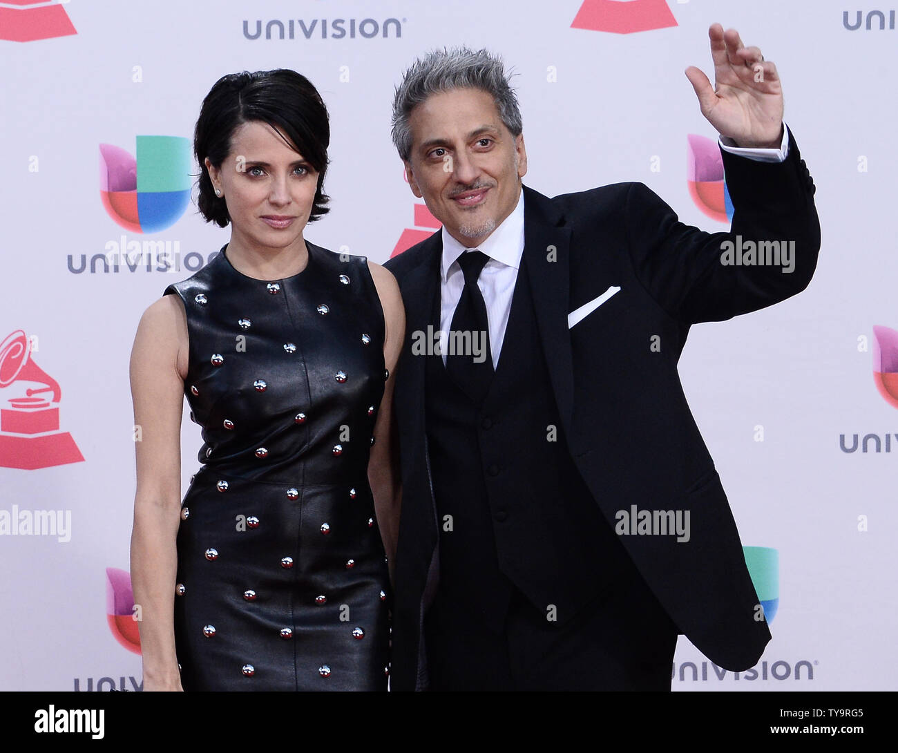 Thom Russo (R) and Alanna Ubach arrive on the red carpet for the 17th annual Latin Grammy Awards ...