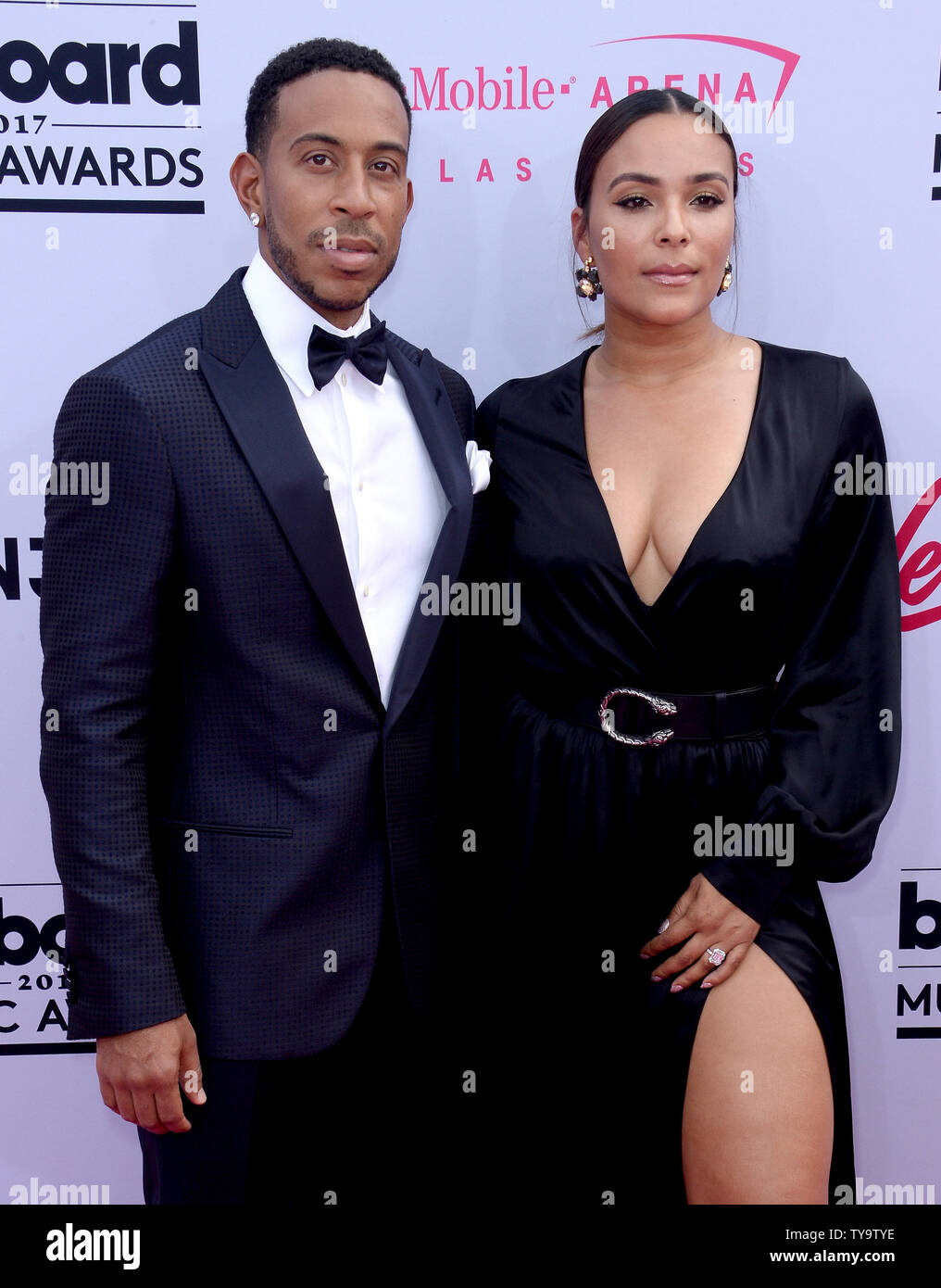 Co-Host Ludacris (L) and Eudoxie Mbouguiengue attend the annual ...