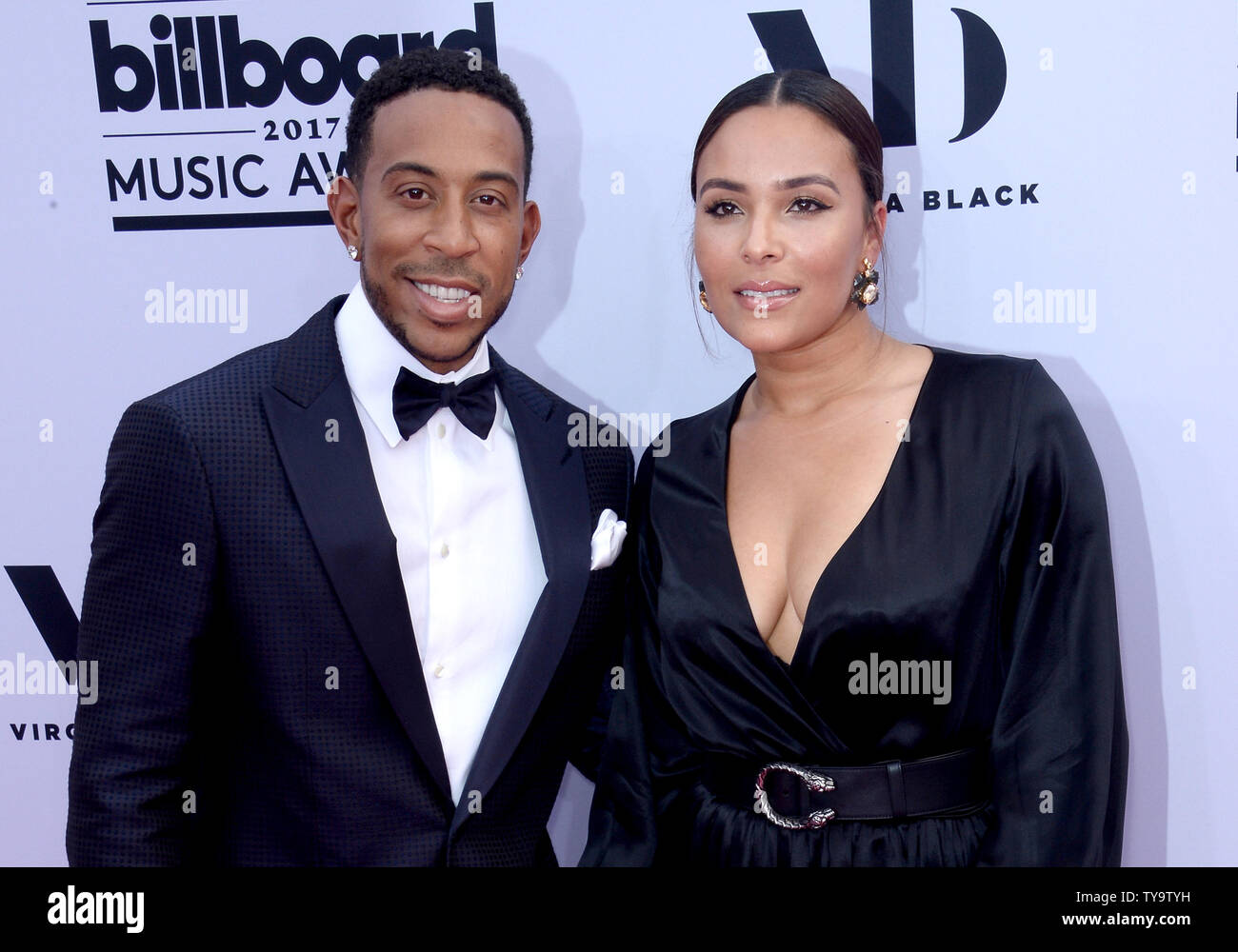 Co-Host Ludacris (L) and Eudoxie Mbouguiengue attend the annual ...