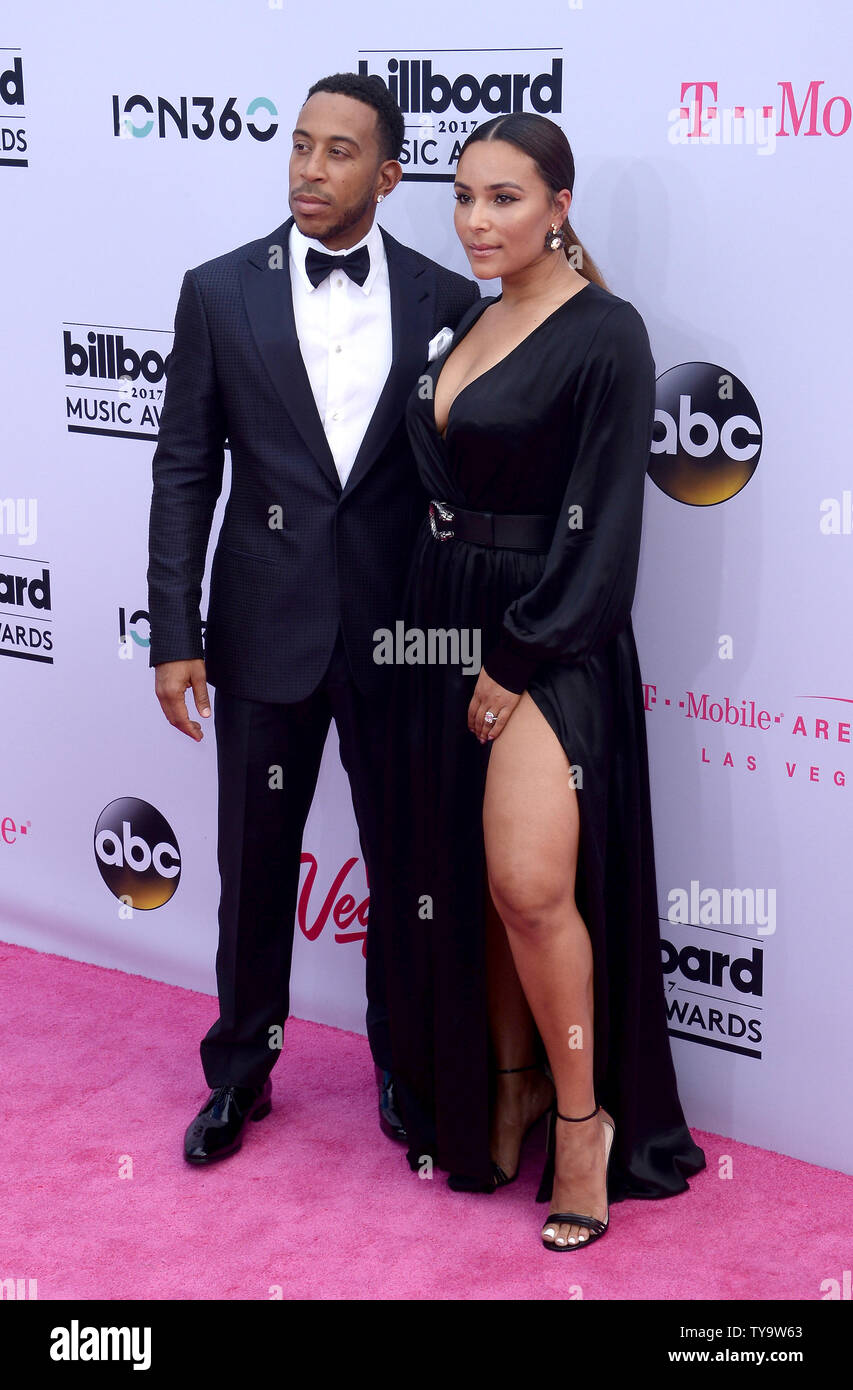Co-Host Ludacris (L) and Eudoxie Mbouguiengue attend the annual ...