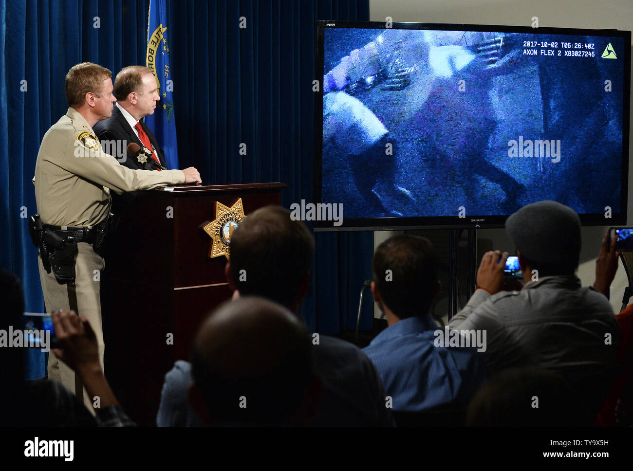 LVMPD Undersheriff Kevin McMahill (L) views body cam footage with ...