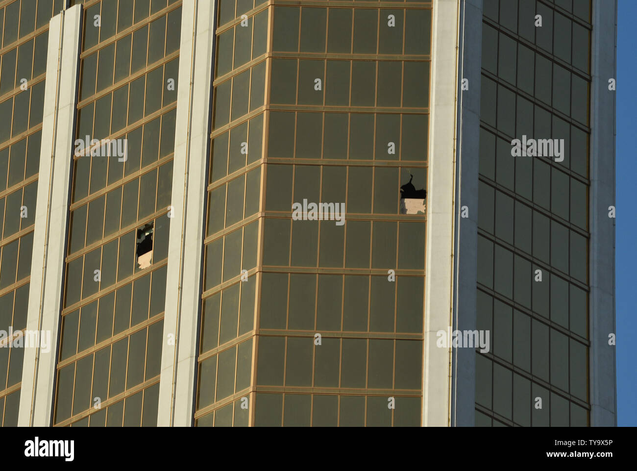 Two smashed windows can be seen on the 32nd floor of the Mandalay Bay ...