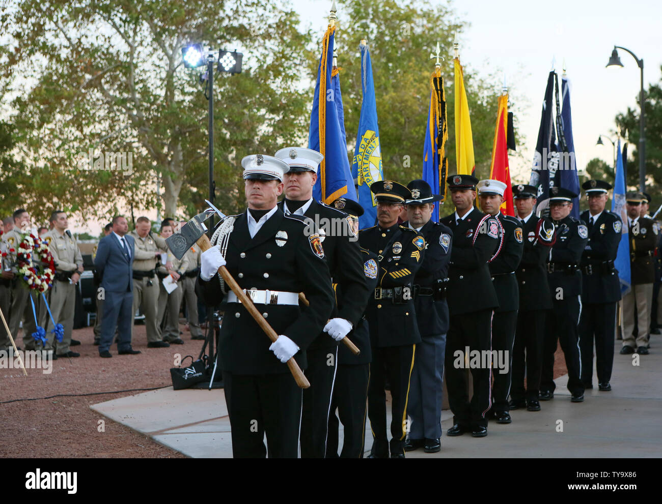 Members of the public join police officers and their families during a ...
