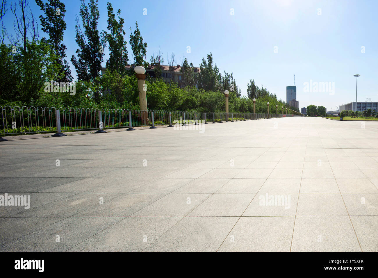 long empty footpath in modern city square with skyline Stock Photo - Alamy