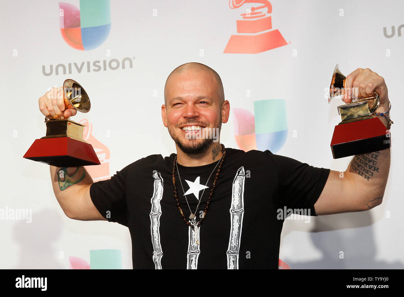 Puerto Rican rapper Residente appears backstage with the awards for ...