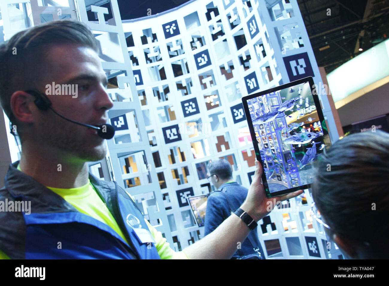A demonstration of the artificial intelligence tower at the Intel booth ...