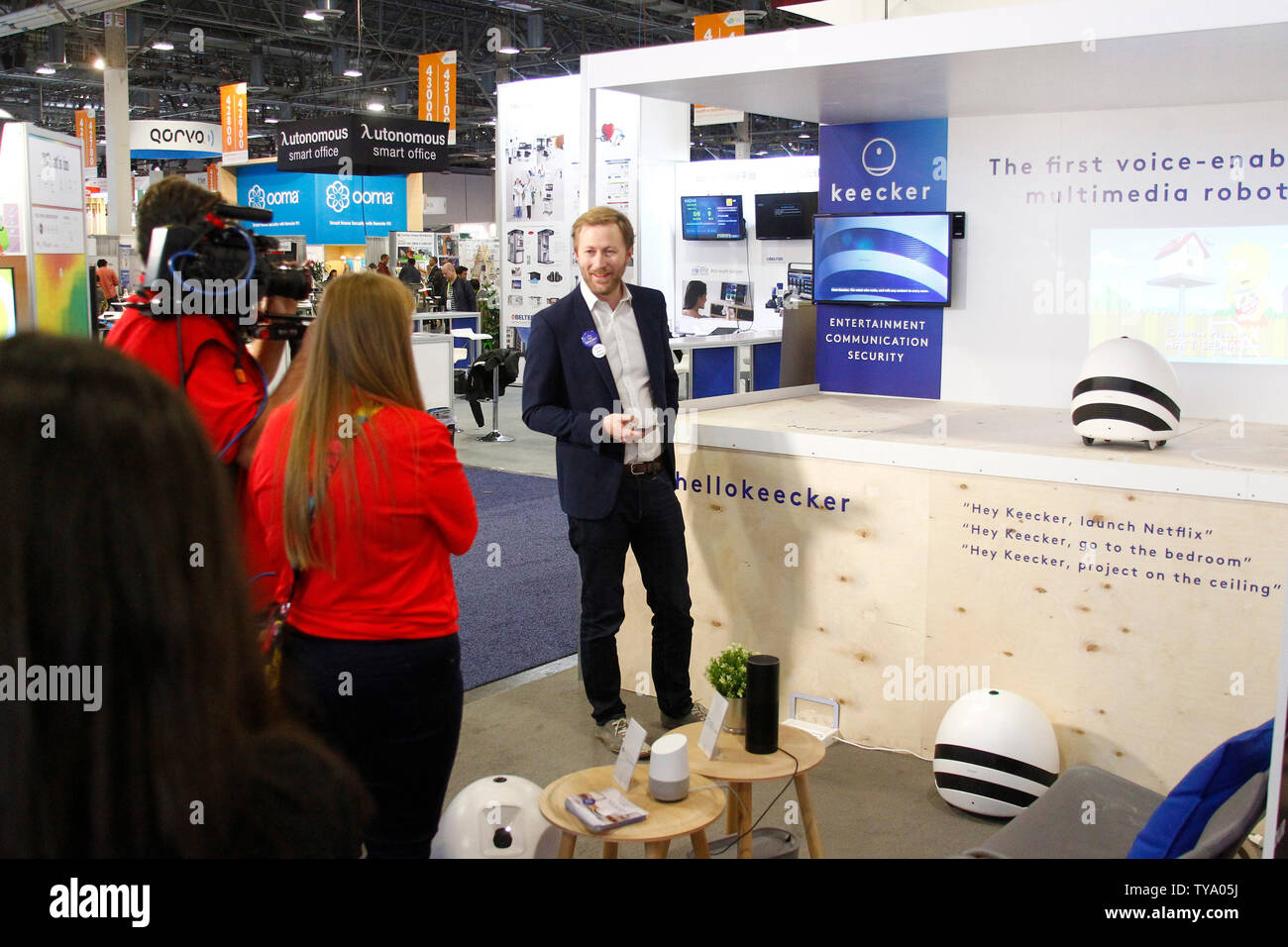 A Keecker representative demonstrates their voice-enabled multimedia ...