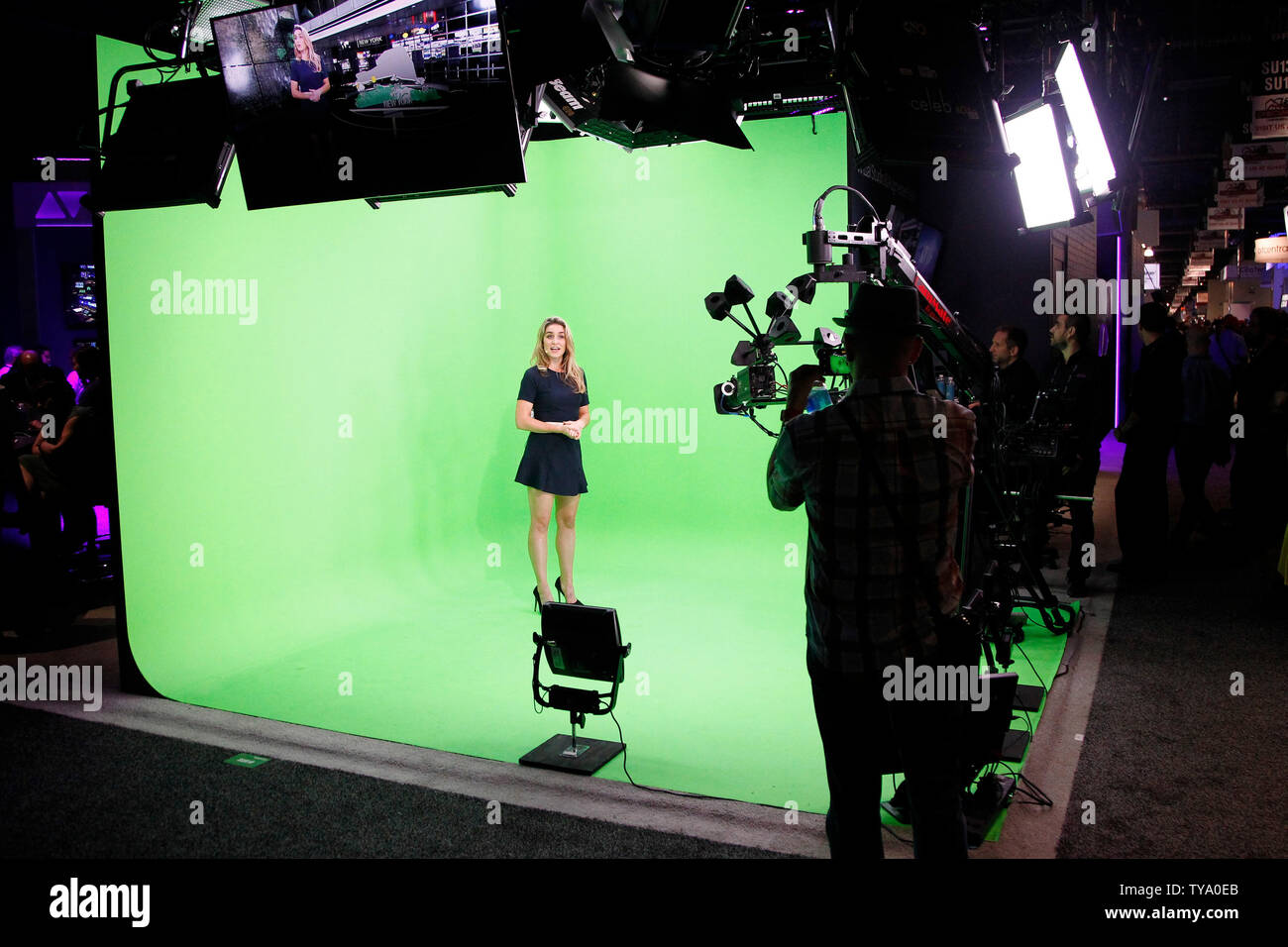 A female spokes model acts in a live television demonstration on a ...