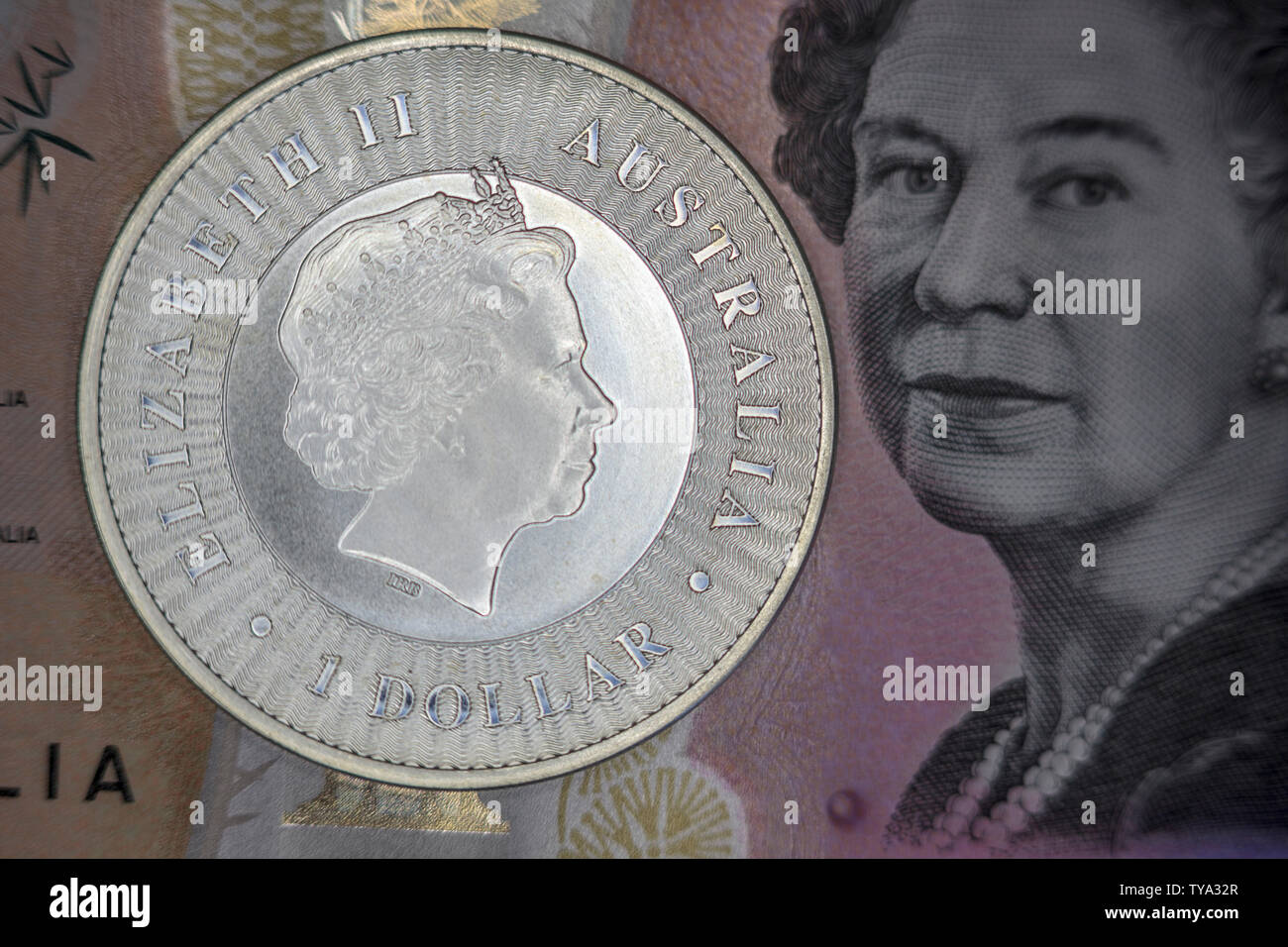 silver coin on banknote Stock Photo - Alamy