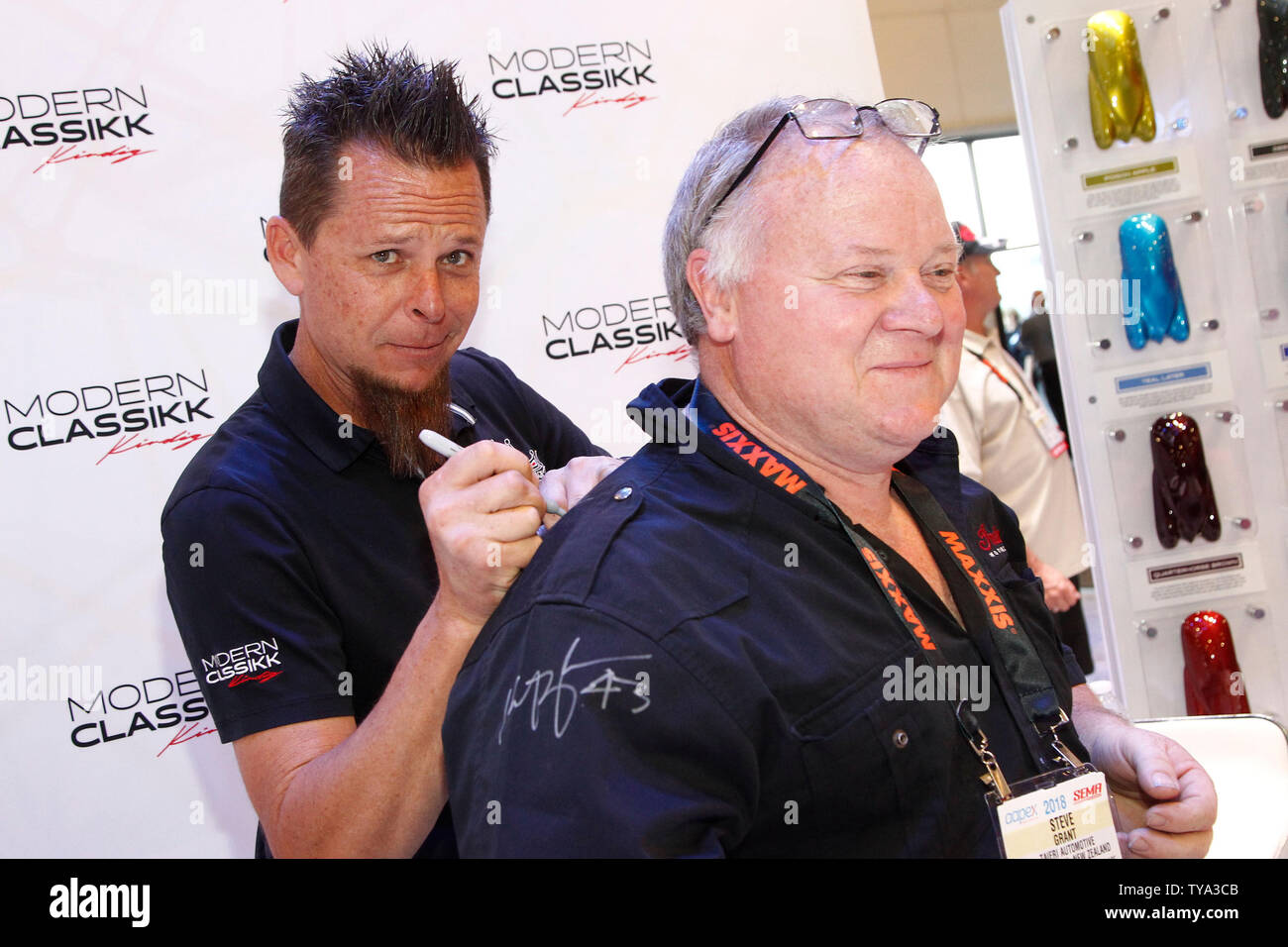 Car designer Dave Kindig of 'Kindig It Design' signs the back of a New ...