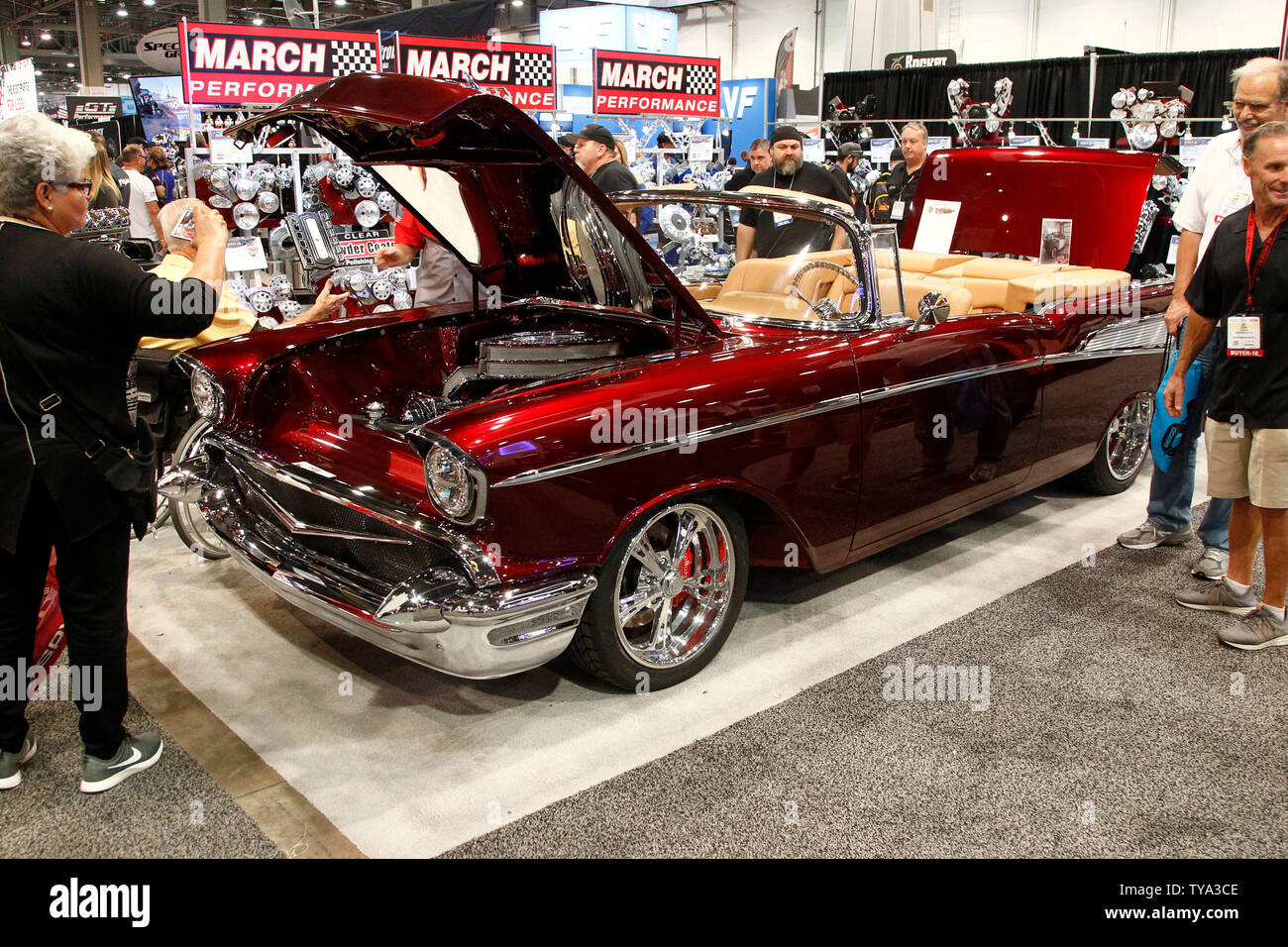 Car fans stop to take photos of a customized 1957 Chevy "March Madness ...