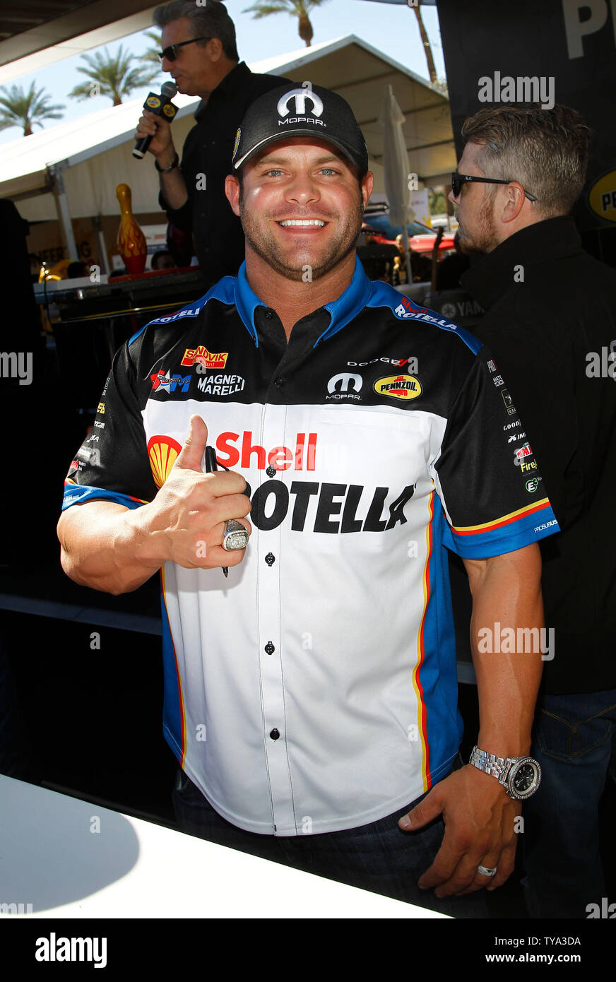 Drag car racer Matt Hagan signs autographs during the 2018 SEMA Show ...