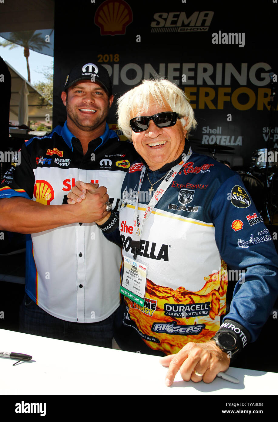 Drag car racer Matt Hagan poses for a photo with television host Jimmy ...