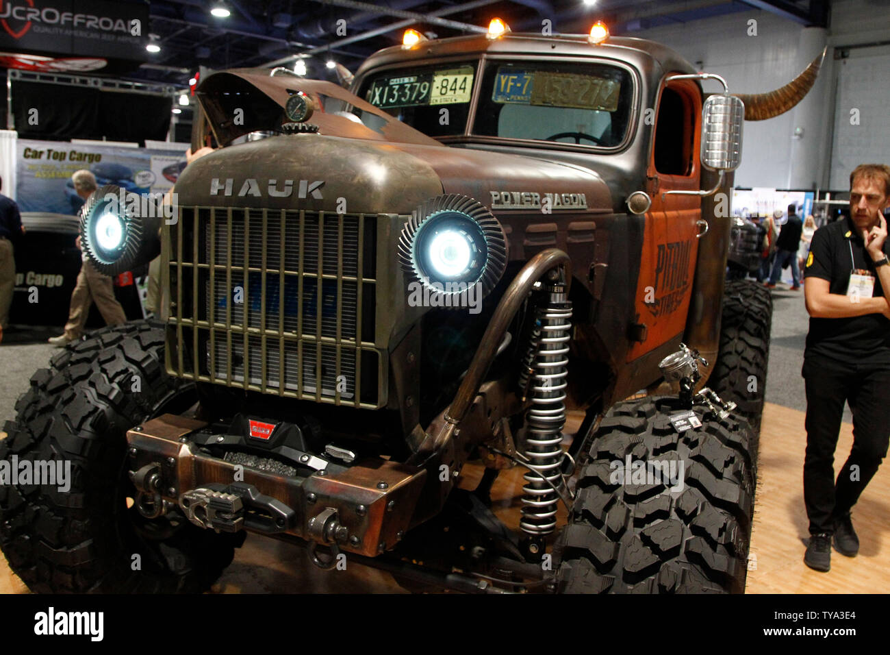 A neighoring exhibitor takes a closer view of "The Wrecker", a ...