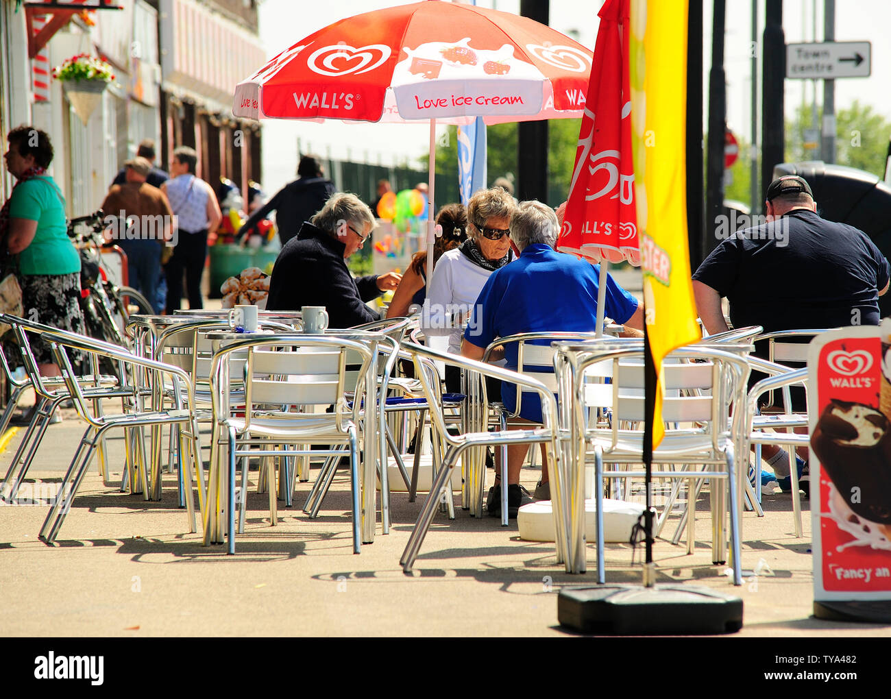 Diners eating at tables on pavement infront of cafe in Fleetwood on a ...
