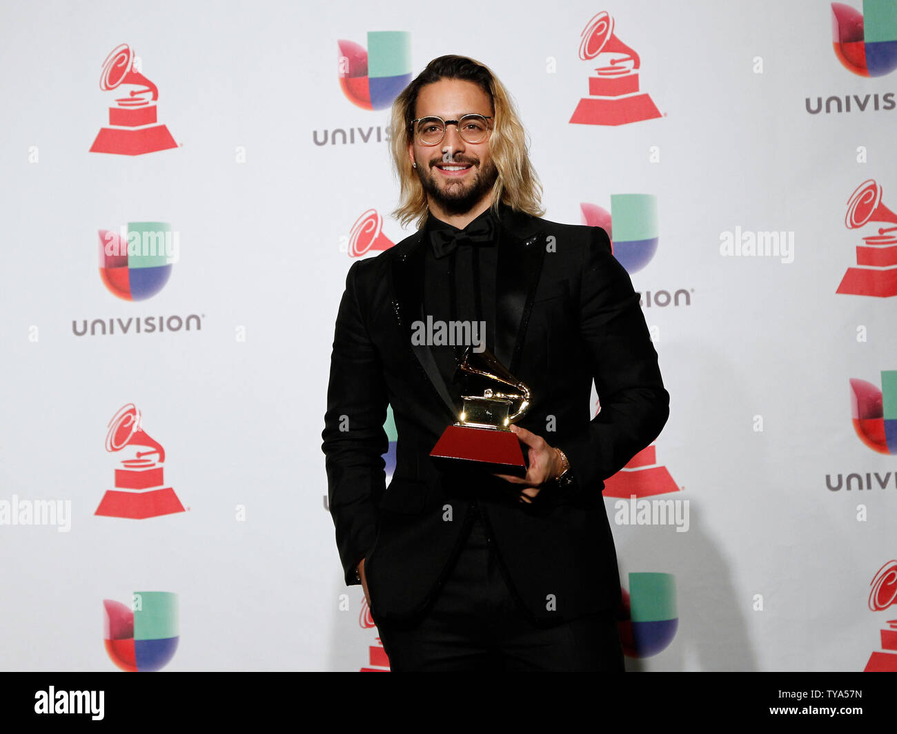 Maluma appears backstage with the award for best contemporary pop vocal ...