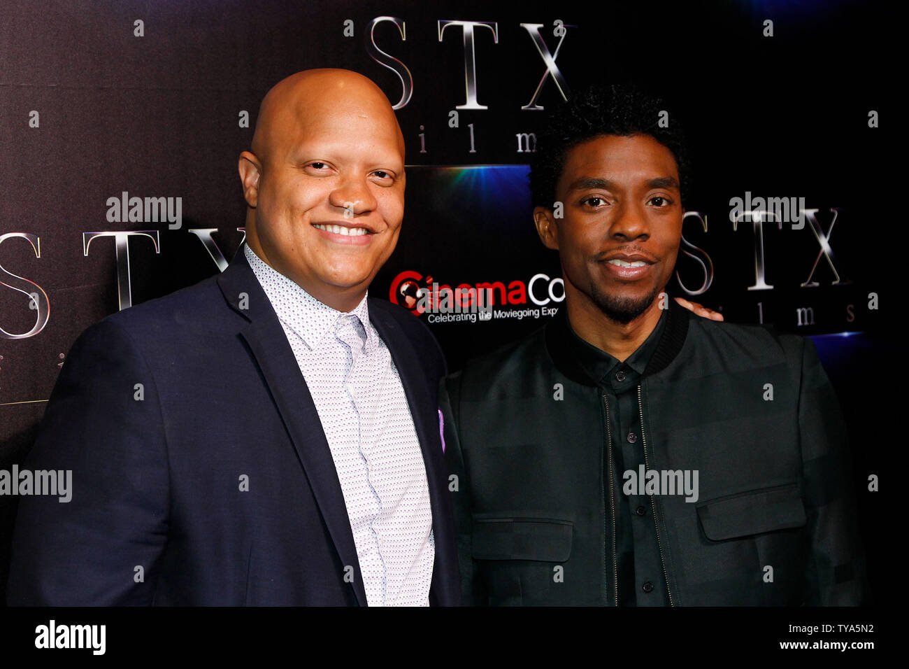 Producer Logan Coles and actor Chadwick Boseman arrive for the ...