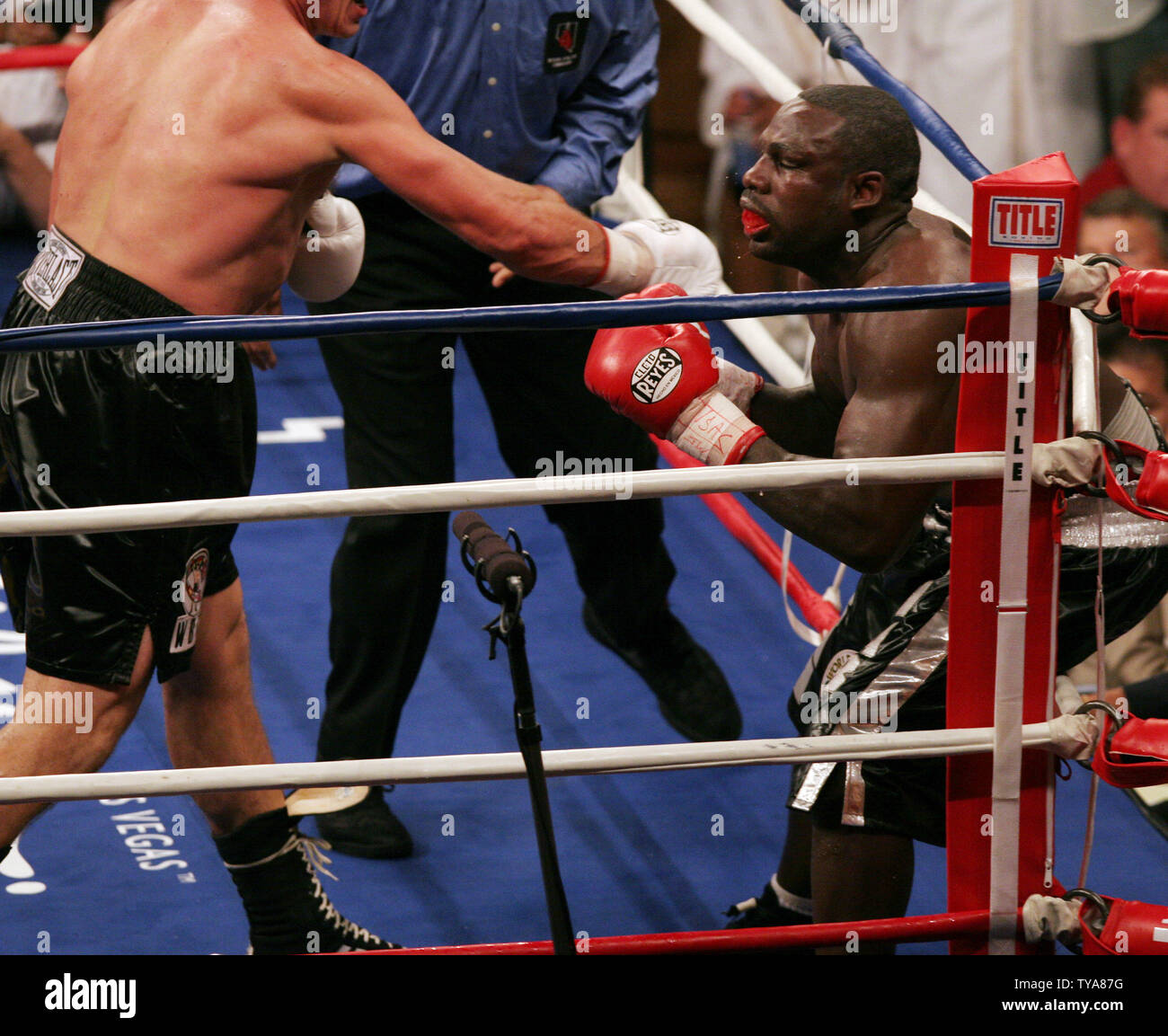 Oleg Maskaev of Kazakhstan (L) knocks American Hasim Rahman through the ...