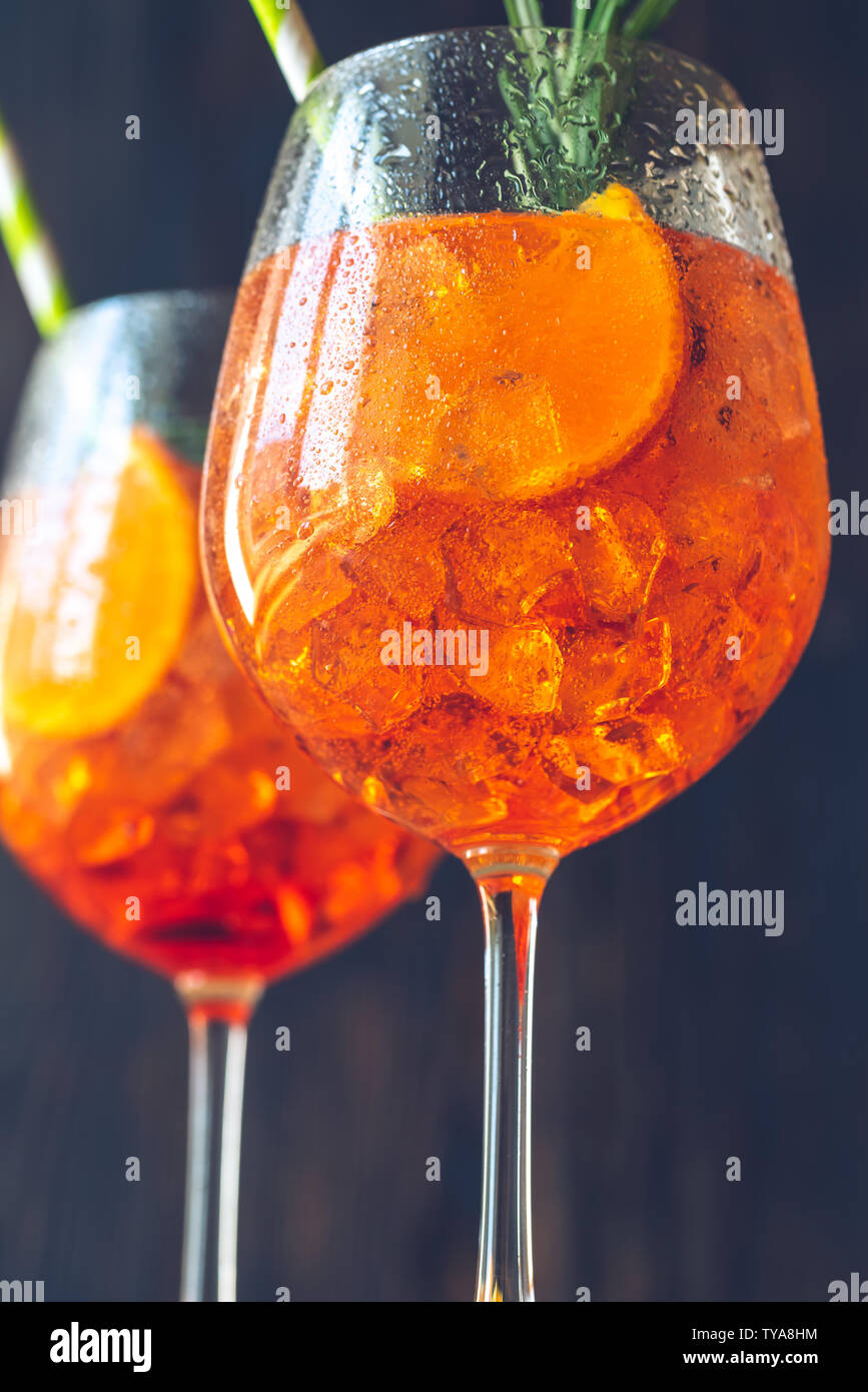 Glasses of Aperol Spritz cocktail on the rustic background Stock Photo ...