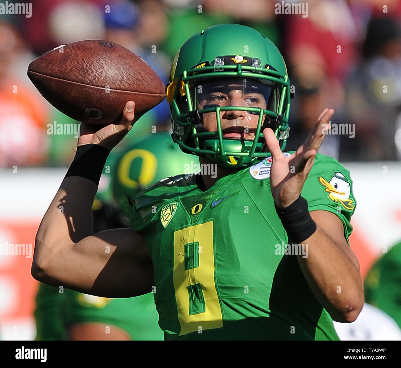 Oregon Ducks quarterback Marcus Mariota (8) warms up before the game ...