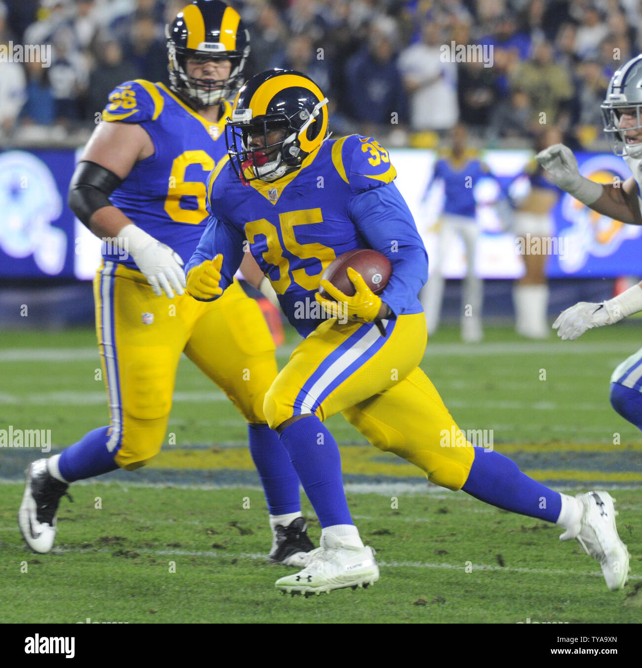 Los Angeles Rams running back C.J. Anderson runs for a gain against the ...