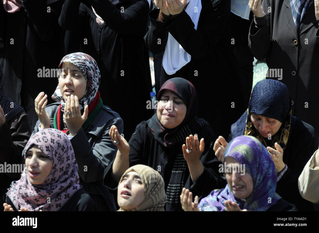Libyan women pray during the funeral of two rebels one of them Faraj ...