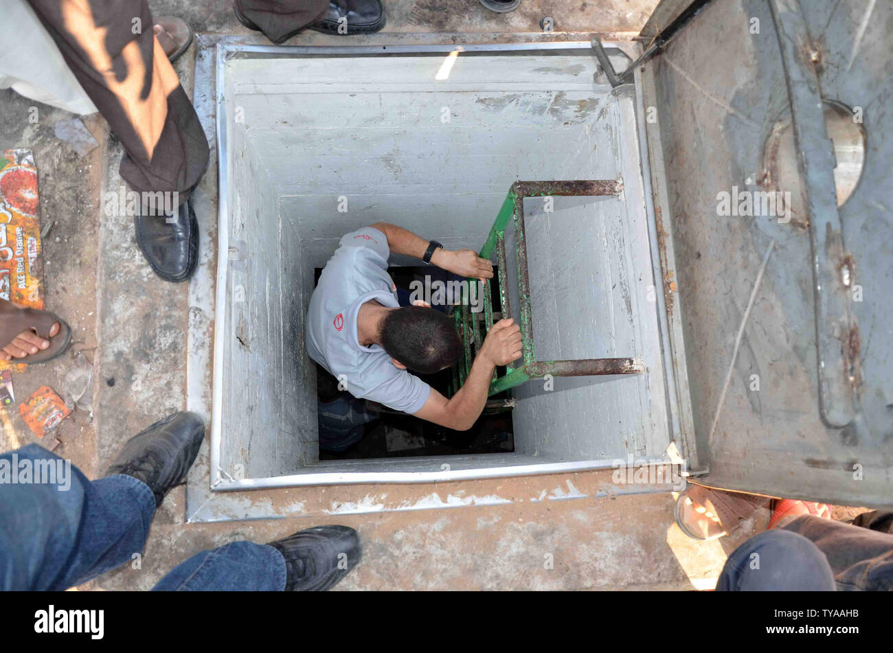 Libyans peers into an underground tunnel at inside of Baba al Azizia ...