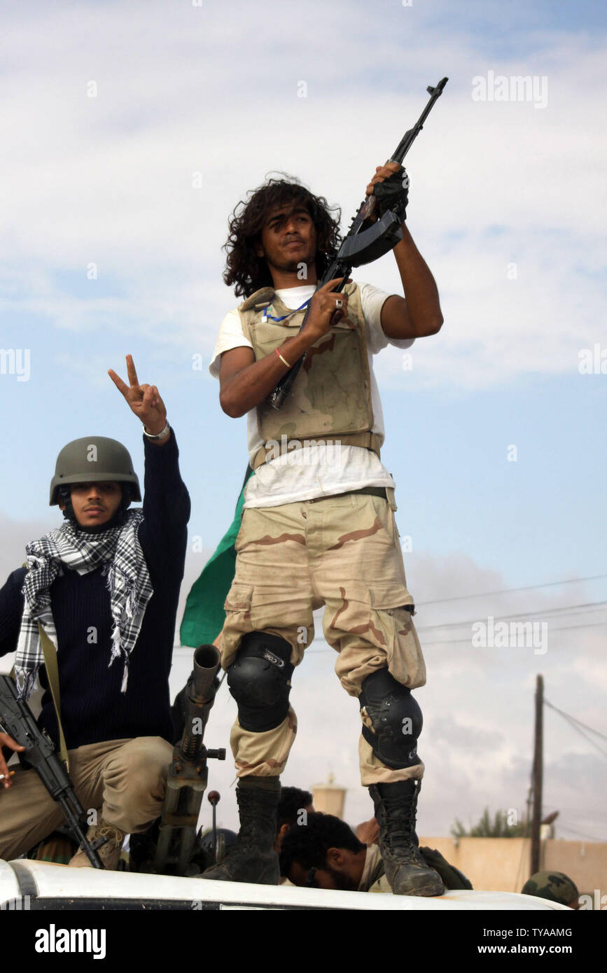 Libyan National Transitional Council (NTC) fighters arrive in Benghazi ...