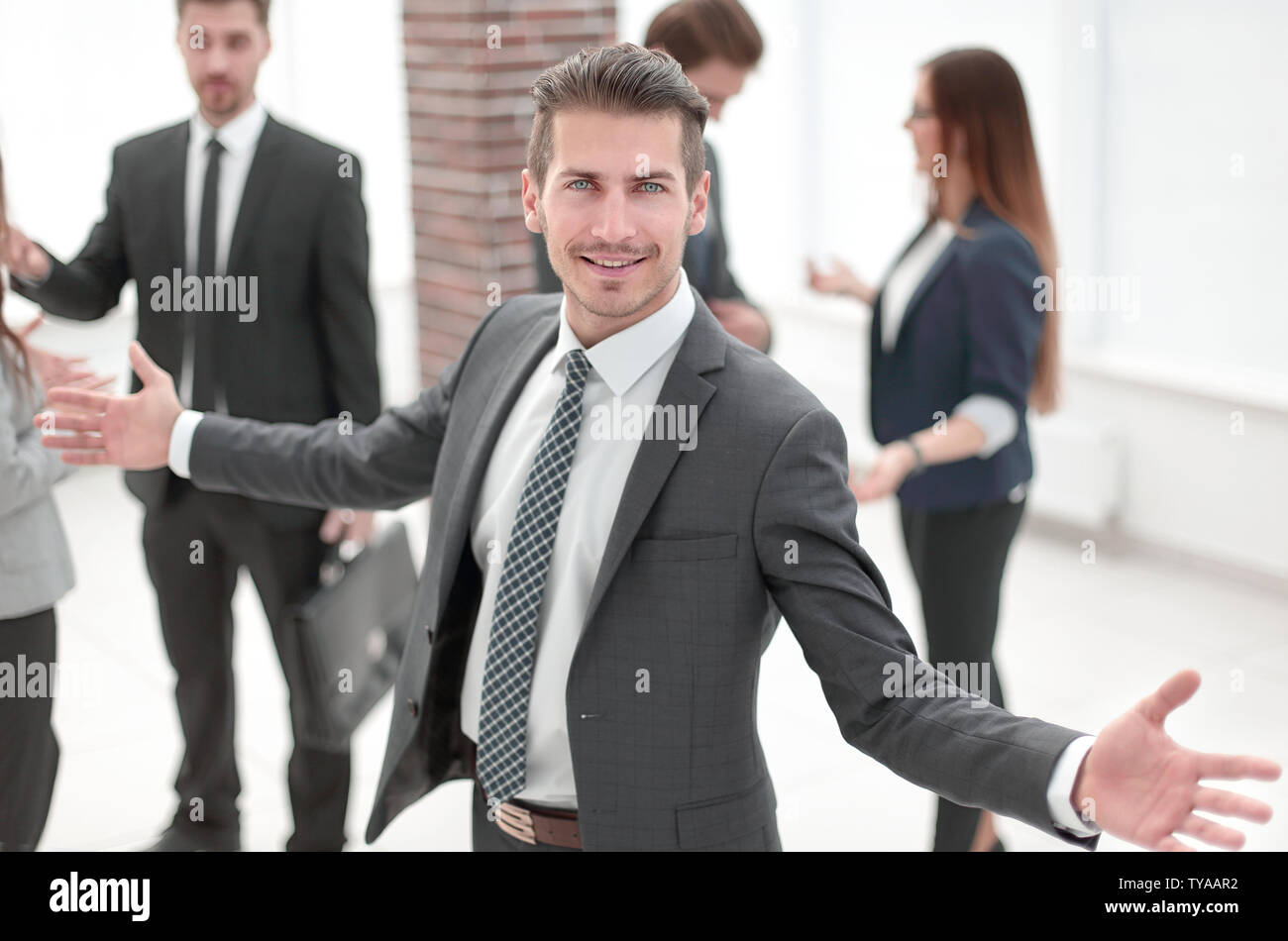 Successful business man with open arms Stock Photo - Alamy