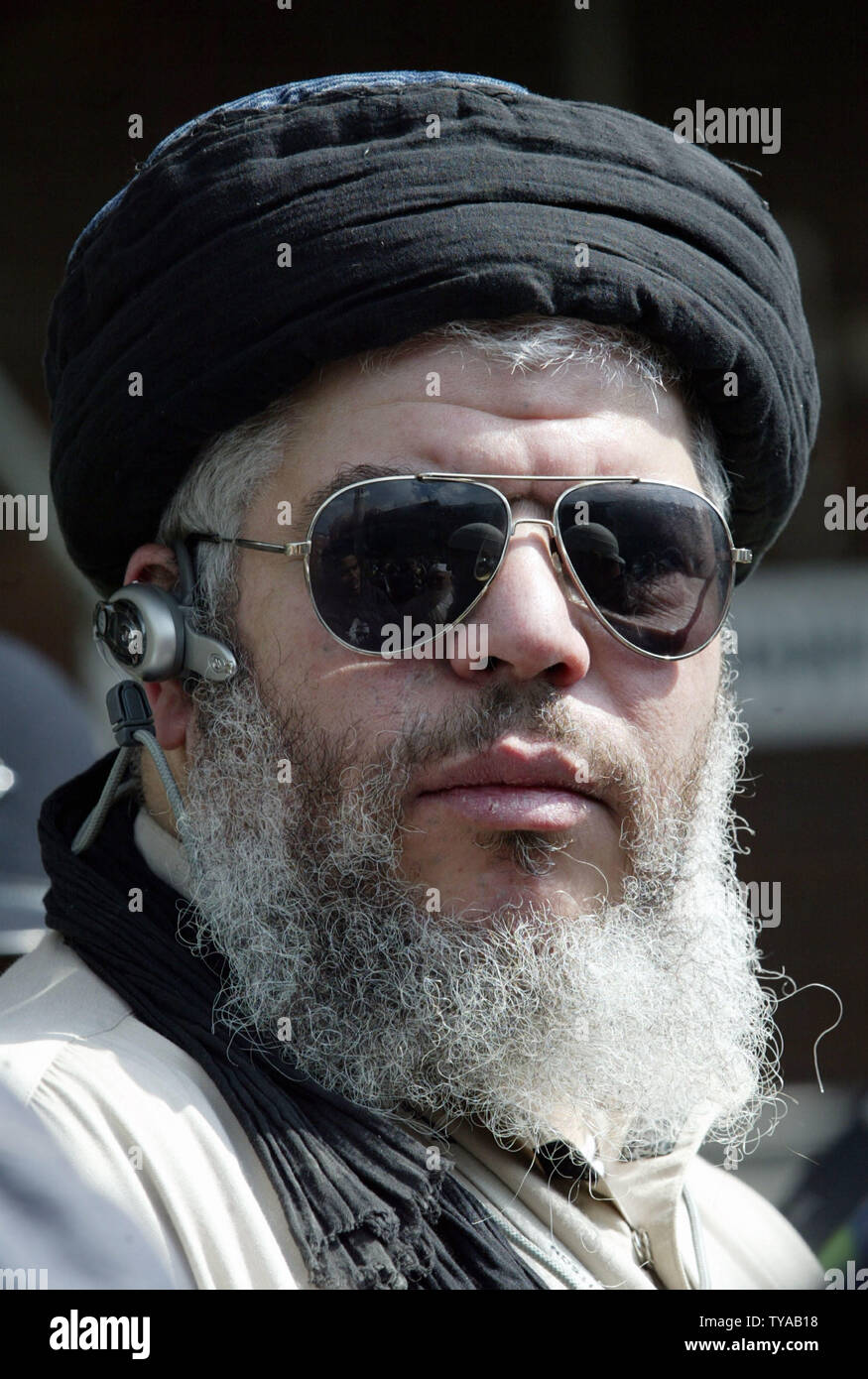 Radical Muslim leader Sheikh Abu Hamza stares at the press after ...
