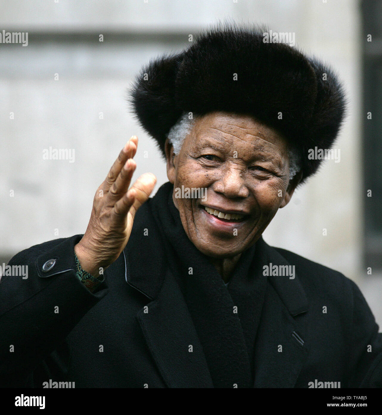 Nelson Mandela waves after delivering a speech for the charity "Make ...