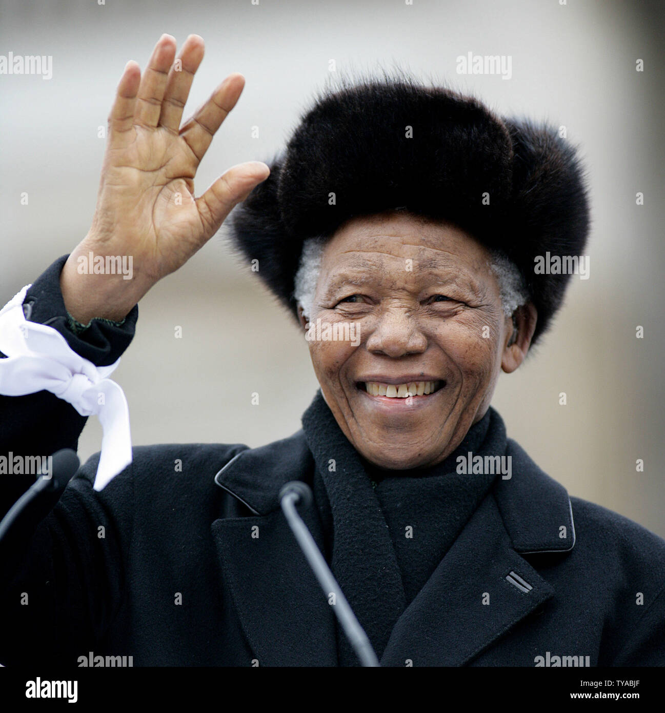 Nelson Mandela waves after delivering a speech for the charity "Make ...