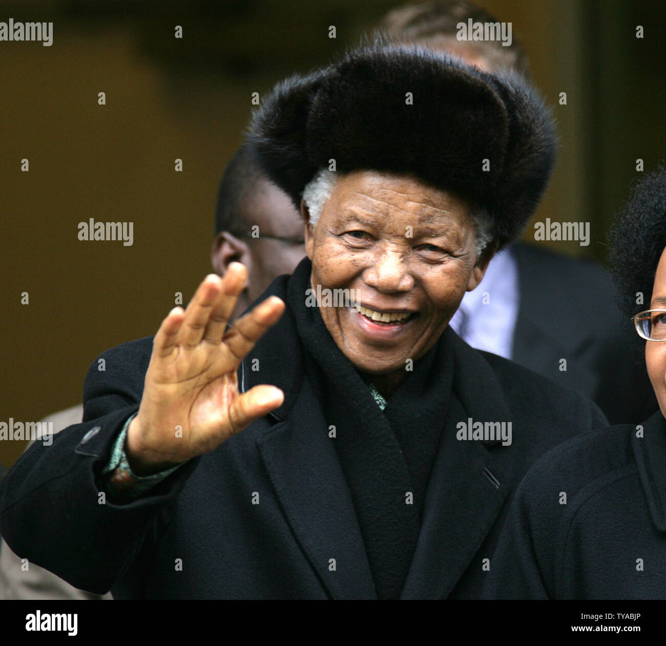 Nelson Mandela waves after delivering a speech for the charity "Make ...