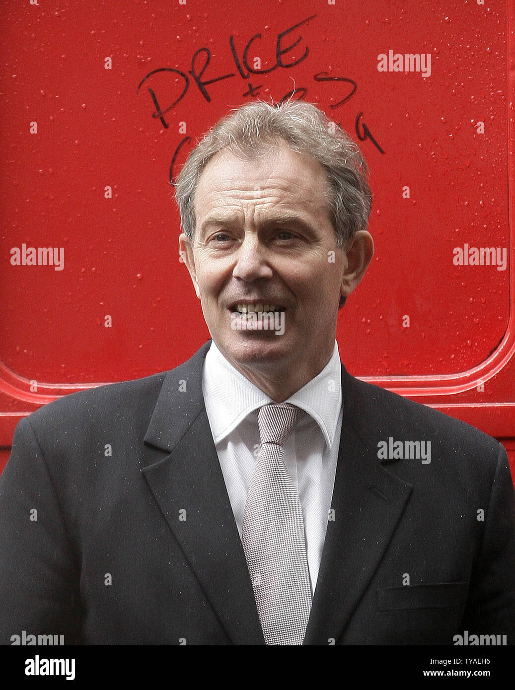 British Prime Minister Tony Blair poses for the media before signing a ...