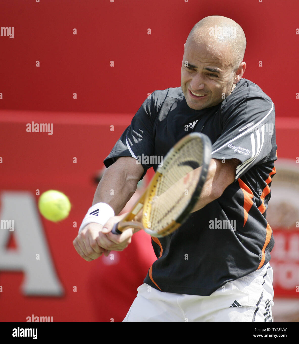 American Andre Agassi plays a backhand in his match against Britain's ...