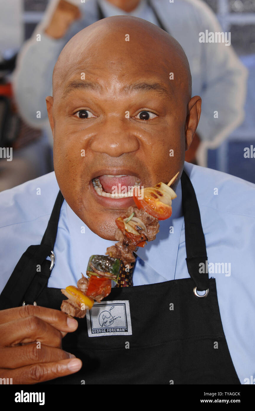 American former heavyweight boxing champion George Foreman demonstrates ...