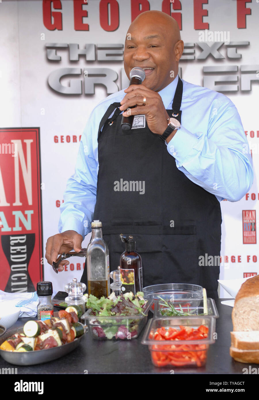 American former heavyweight boxing champion George Foreman demonstrates ...