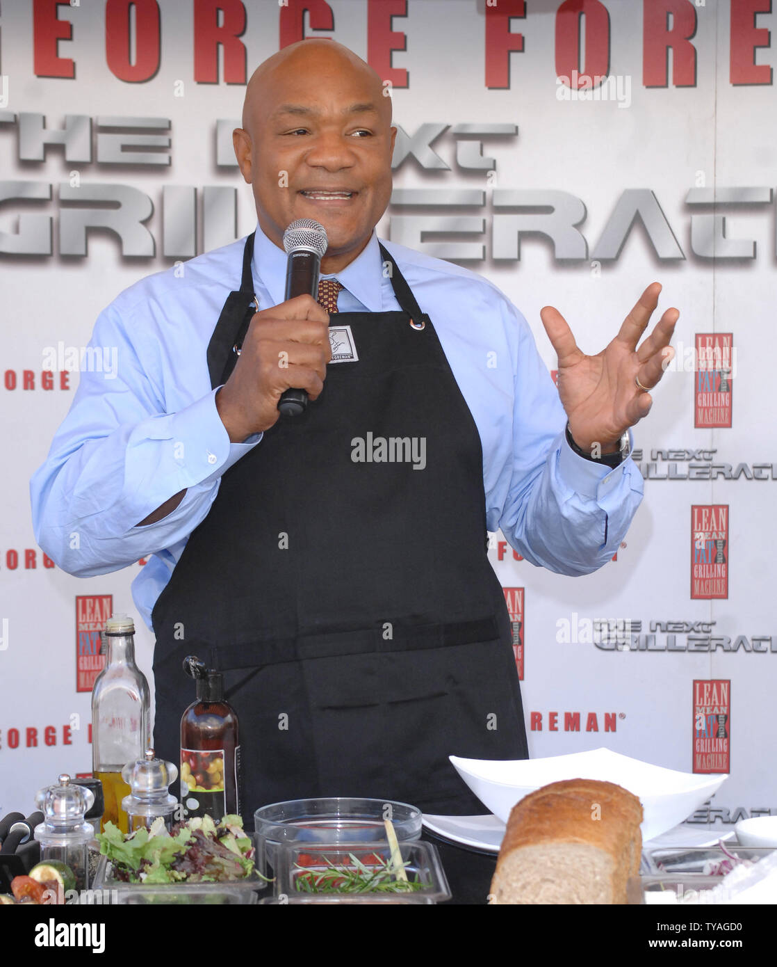 American former heavyweight boxing champion George Foreman demonstrates ...