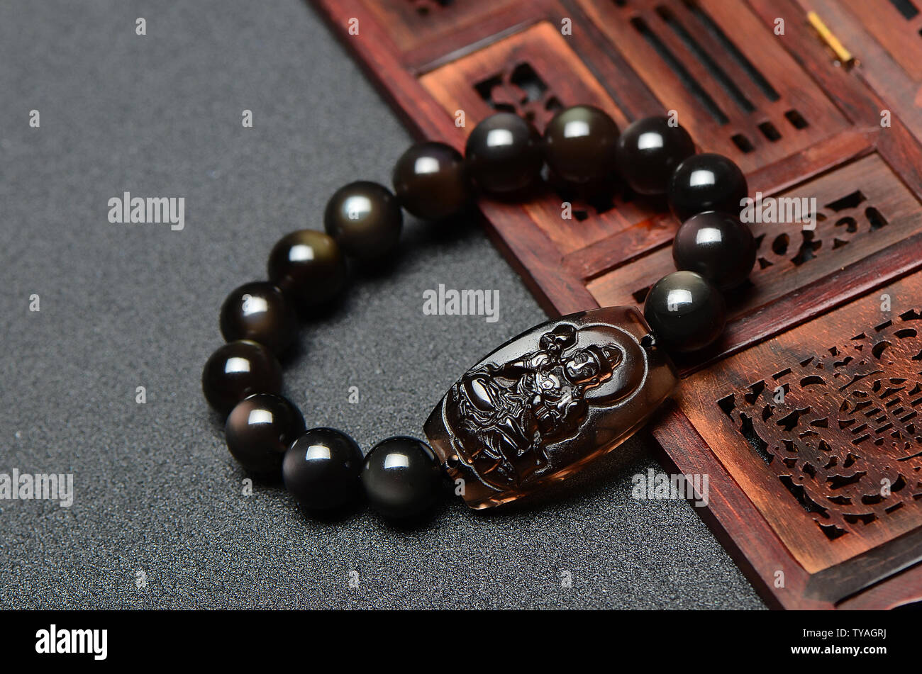 Eight patron saint obsidian bracelets Stock Photo - Alamy