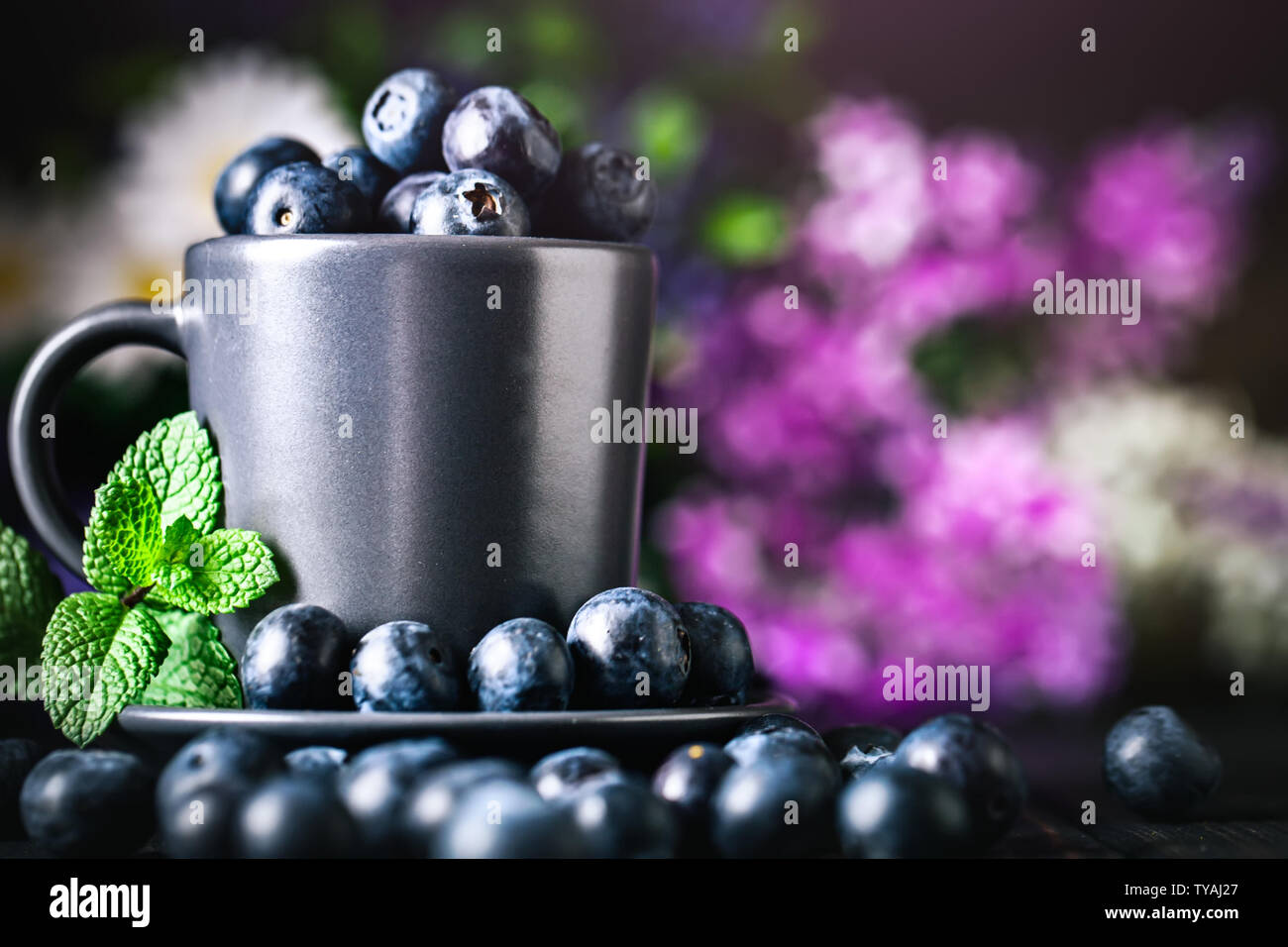 Blueberries in a Cup on a dark background. Summer and healthy food ...