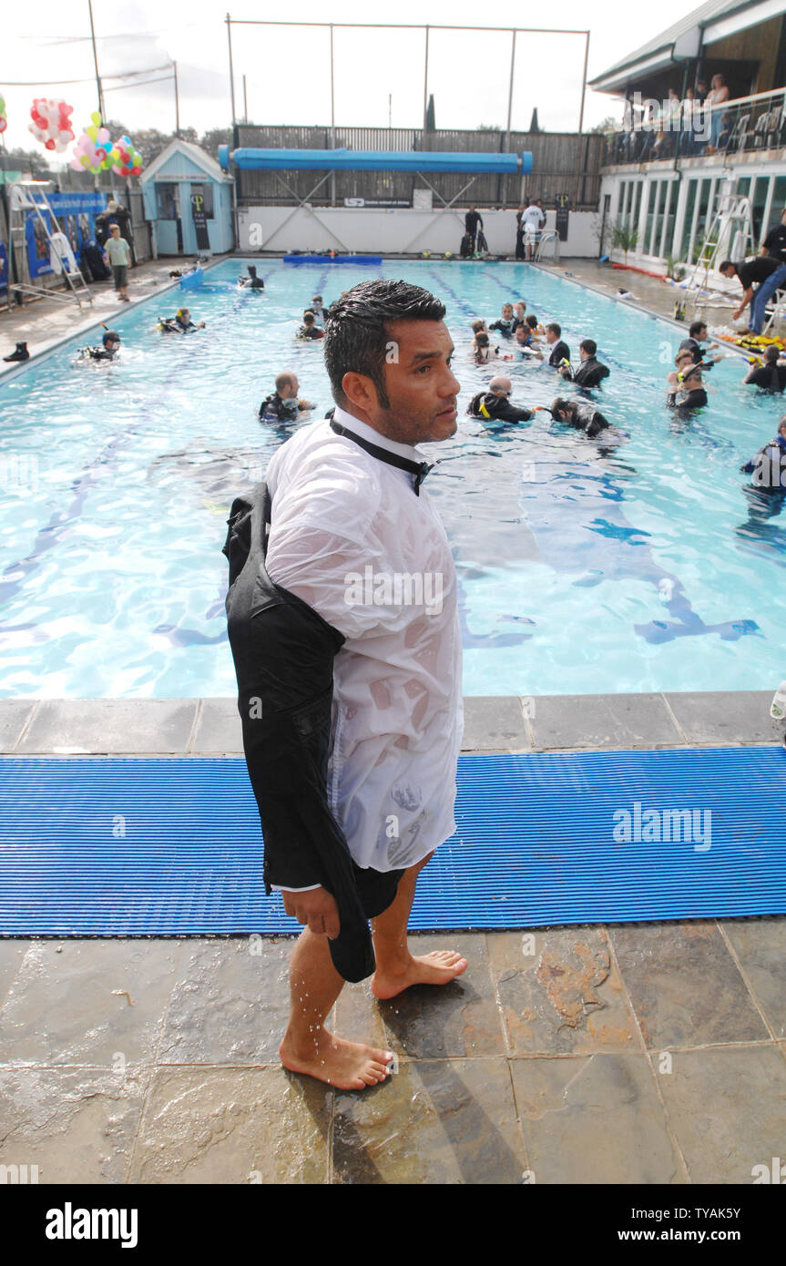 A guest attends "The World's Largest Formal Underwater Dinner Party", a ...