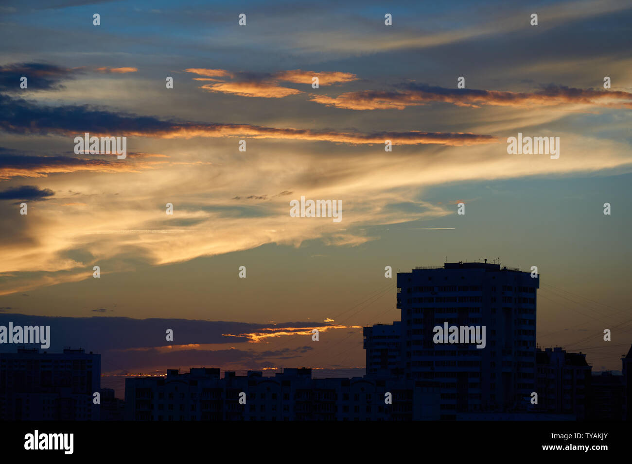 Beautiful sunset scene in the city with dark silhouettes of buildings ...