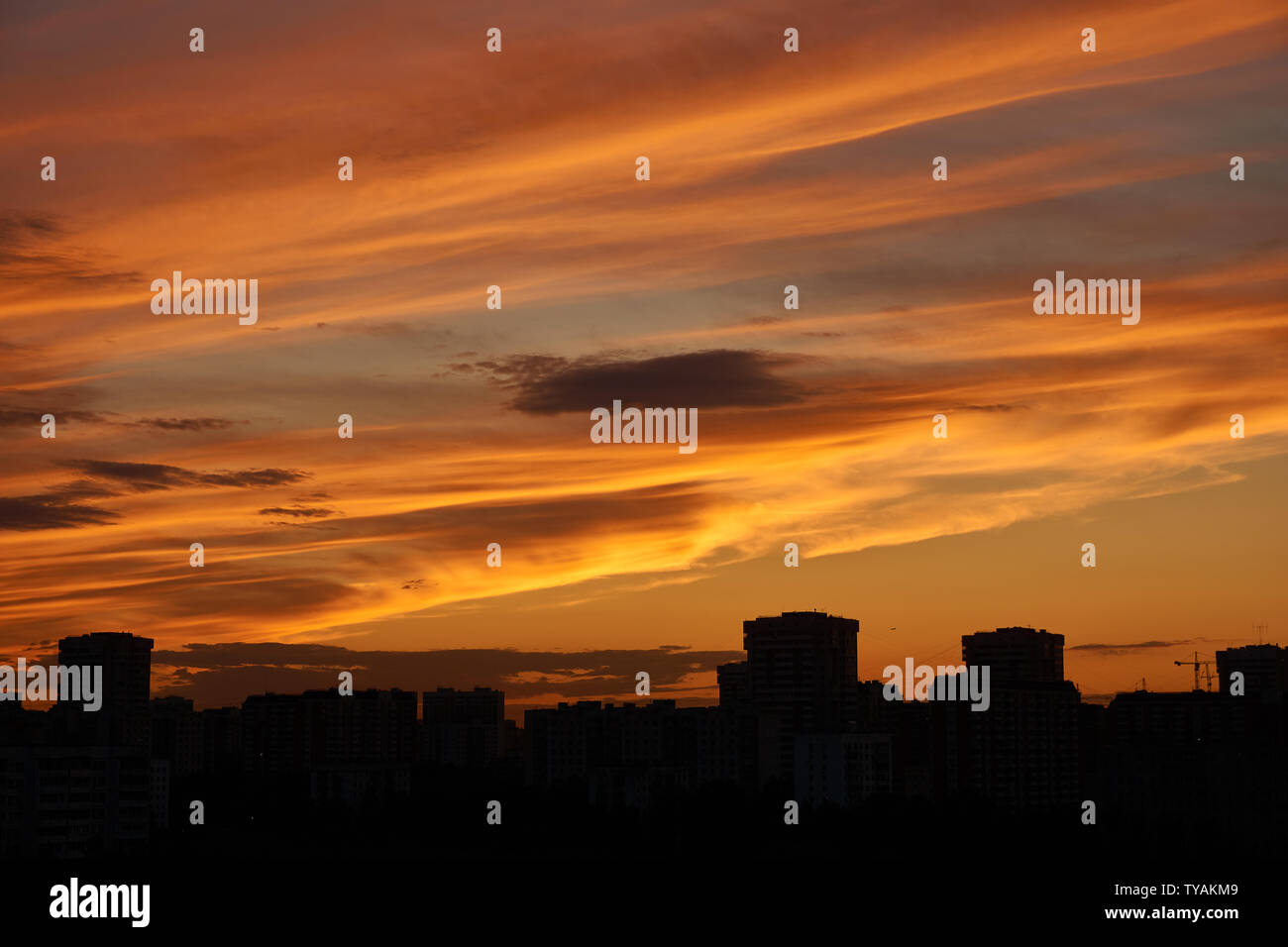 Beautiful sunset scene in the city with dark silhouettes of buildings ...