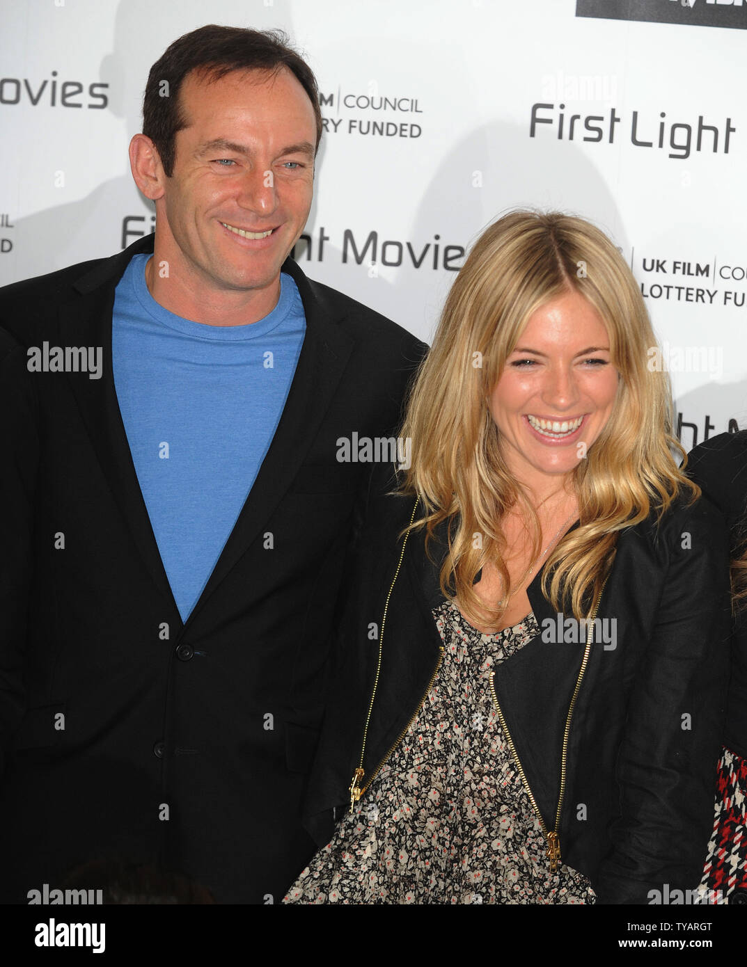 British actress Sienna Miller and actor Jason Isaacs attend the "First ...