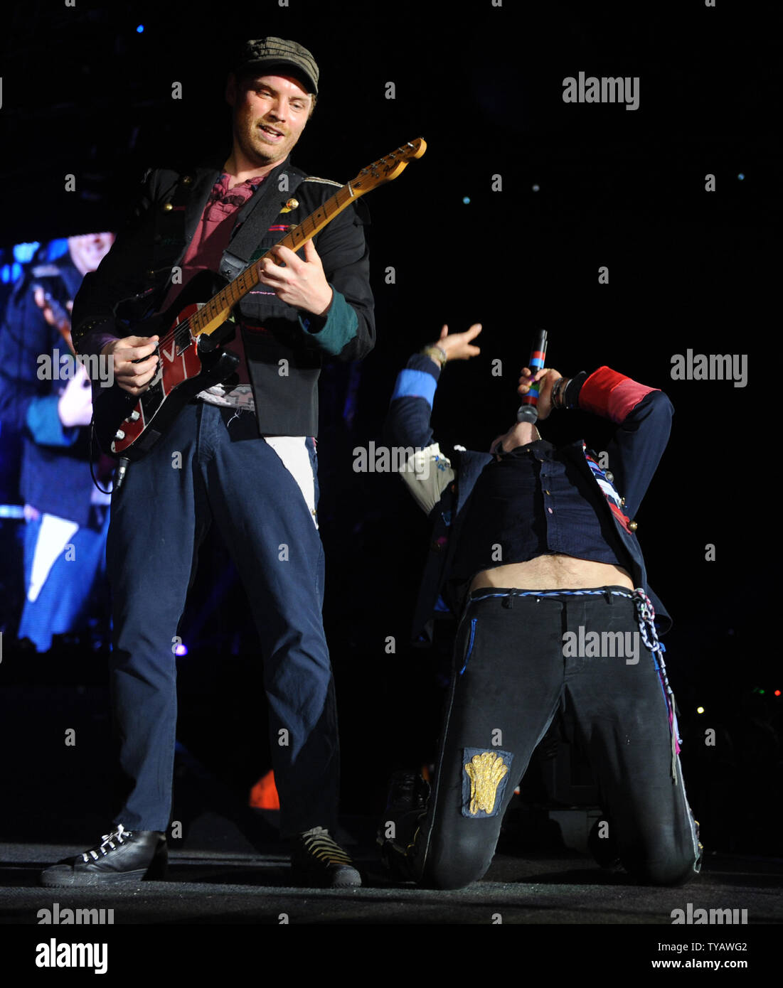 British singer Chris Martin and guitarist Jonny Buckland perform with ...