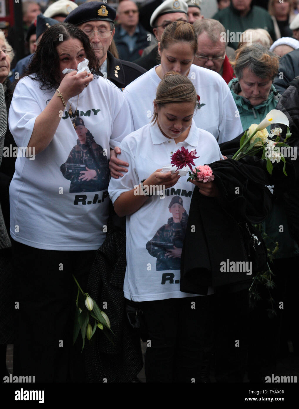 Relatives of dead soldier James Major await his coffin as six British ...