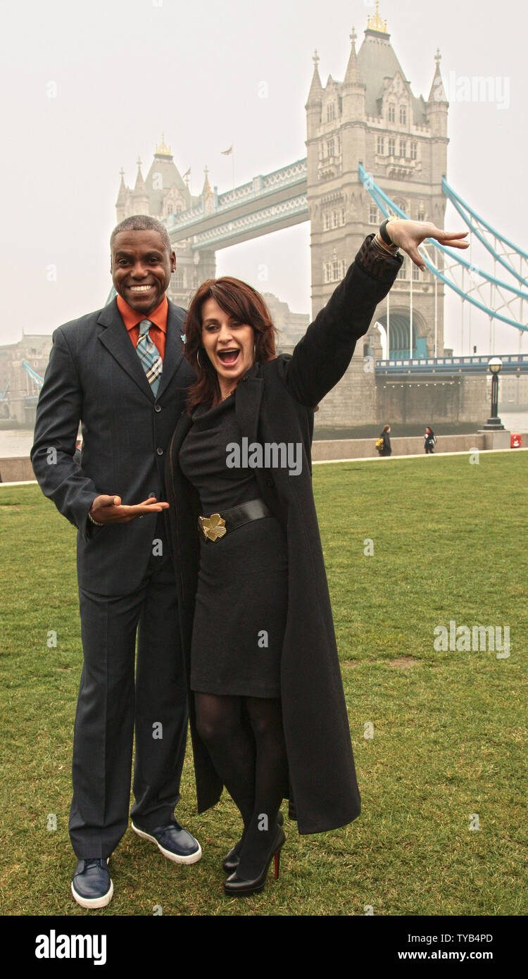 American Olympian Carl Lewis lifts up Romanian Olympian Nadia Comaneci ...