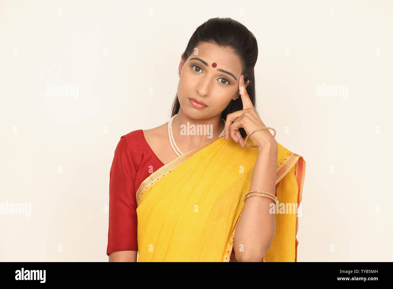 Portrait of a woman thinking Stock Photo - Alamy
