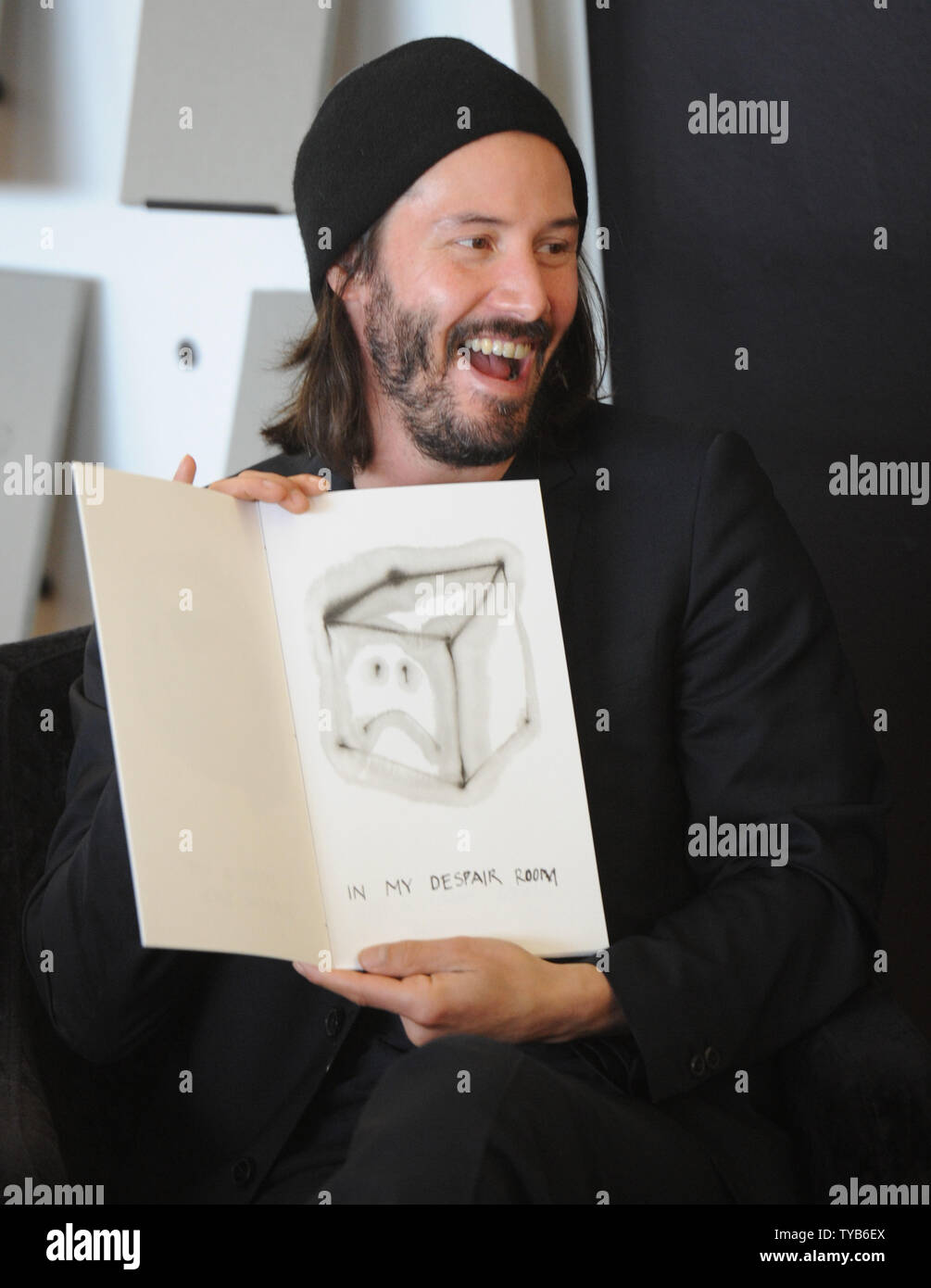 American actor Keanu Reeves attends a signing of his new book "Ode To ...