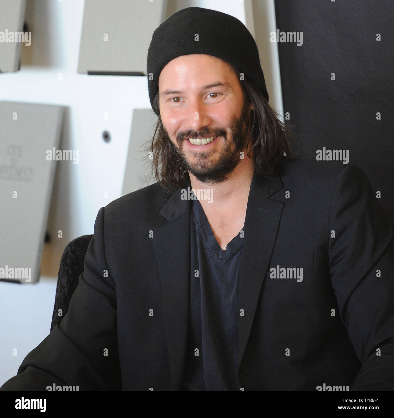 American actor Keanu Reeves attends a signing of his new book "Ode To ...